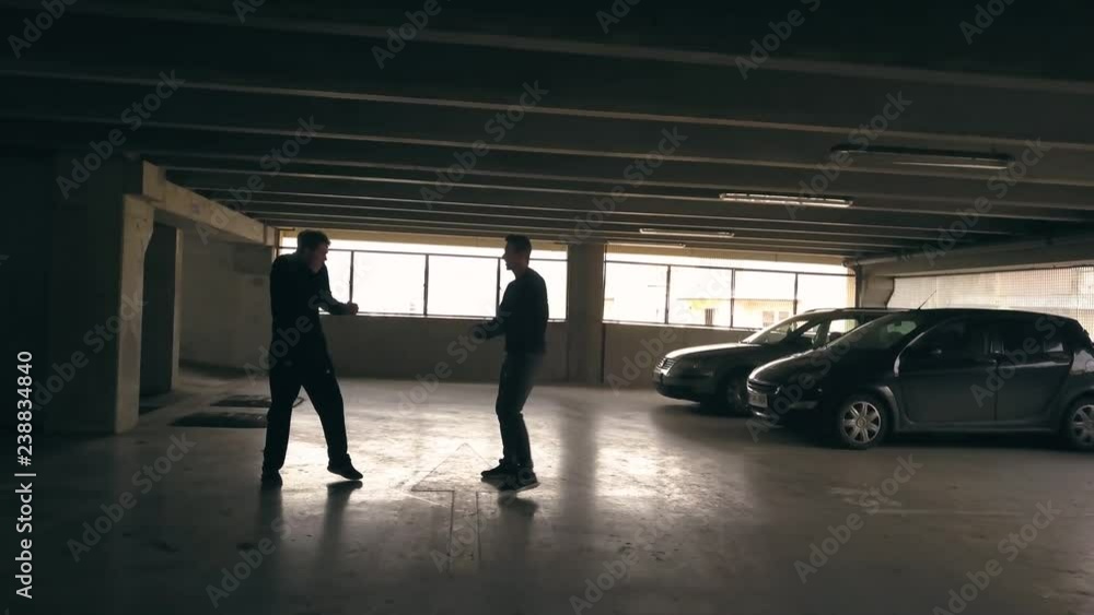 Two men prepare for an action scene in a movie. Stunt men rehearse a ...