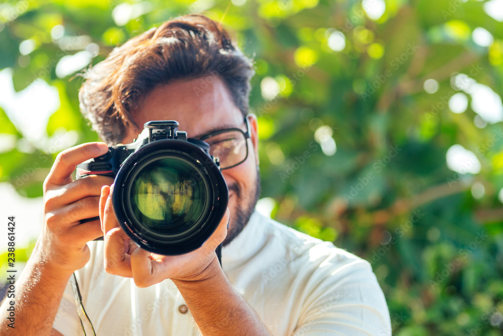 handsome and confident indian man photographer with a large ...