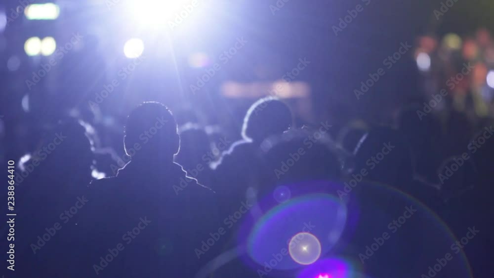 Crowd of people dancing, clapping hands and enjoying a concert with ...