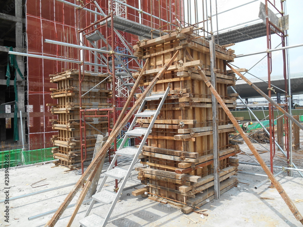 Column timber form work and reinforcement bar at the construction site ...
