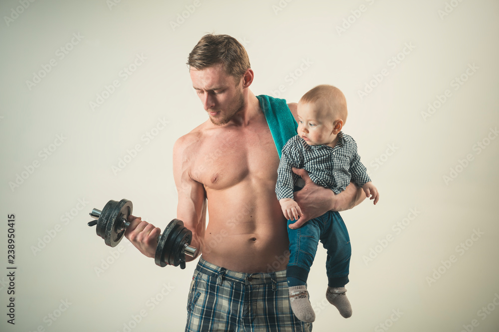 Sport and leisure. Father build biceps triceps with son. Father and ...