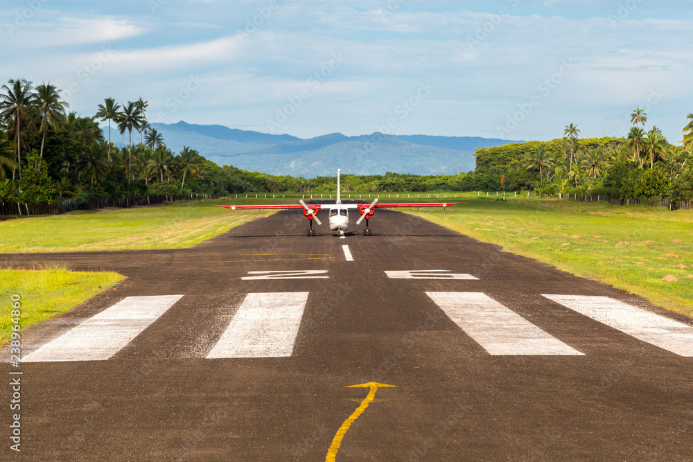 Air travel in Fiji, Melanesia, Oceania. A small propeller airplane just ...