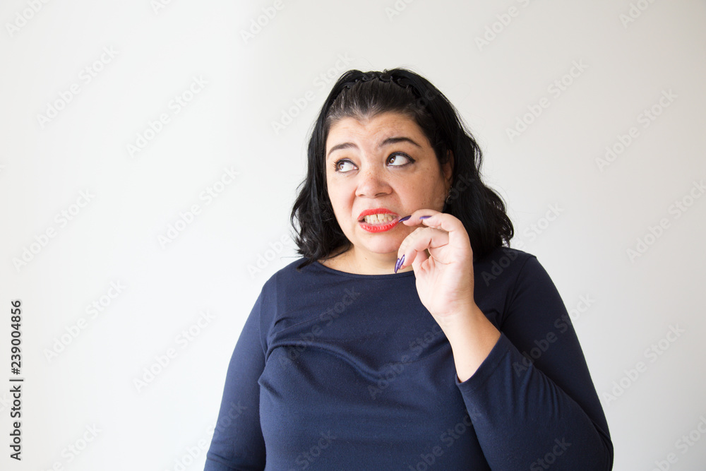 Confused Hispanic woman looking aside on empty space. Scared Latin ...