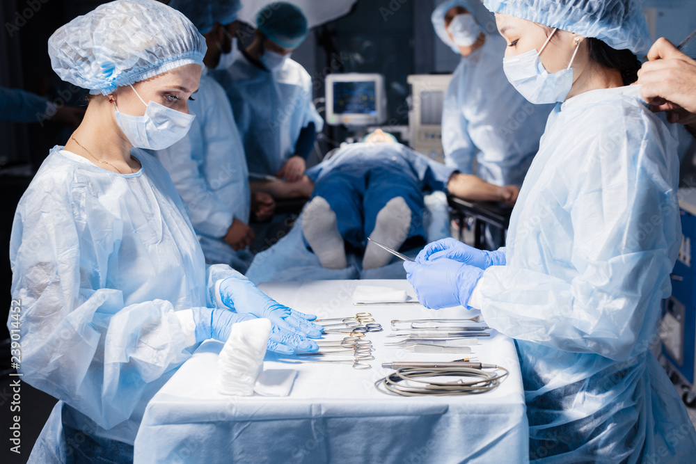 Nurse s hands holding surgical instruments and tools, close up ...