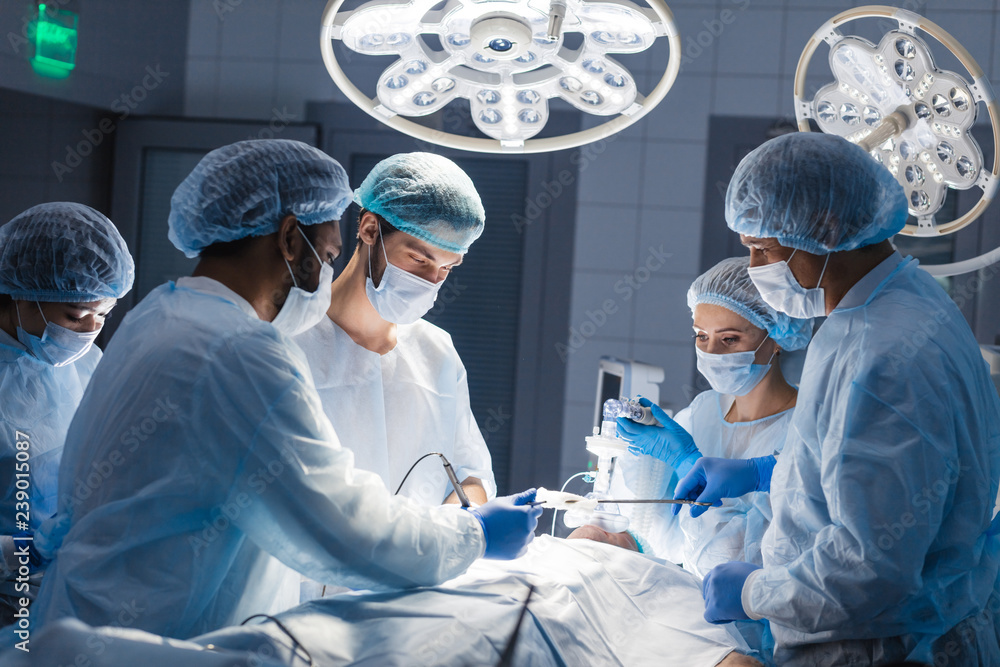 Surgery time at Clinical Hospital. Team of surgeons at work. Complex ...