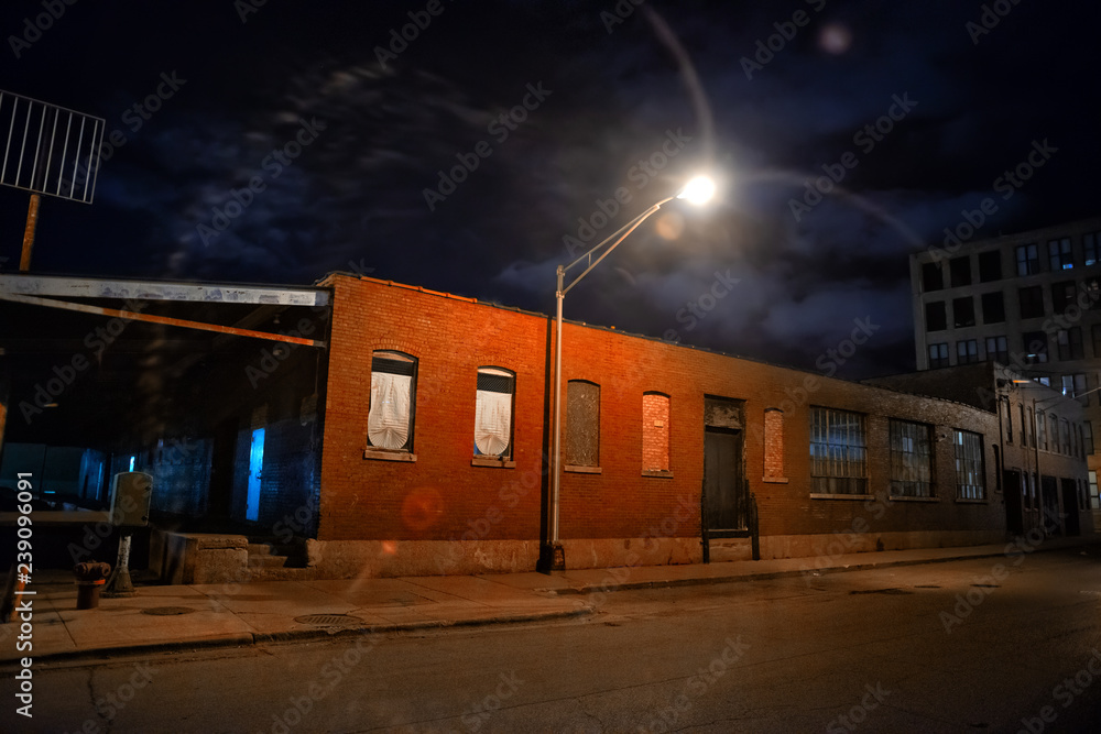 Scary industrial urban street city night scene with a decaying loading ...