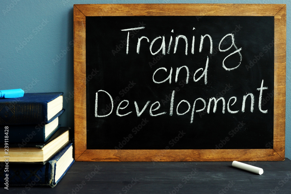 Training and development handwritten on a blackboard. Stock Photo ...
