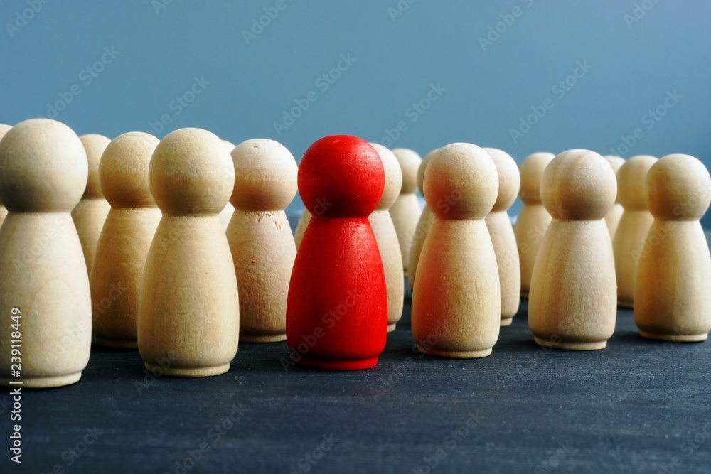 Difference, dissimilarity and distinctness concept. Wooden figures on a ...