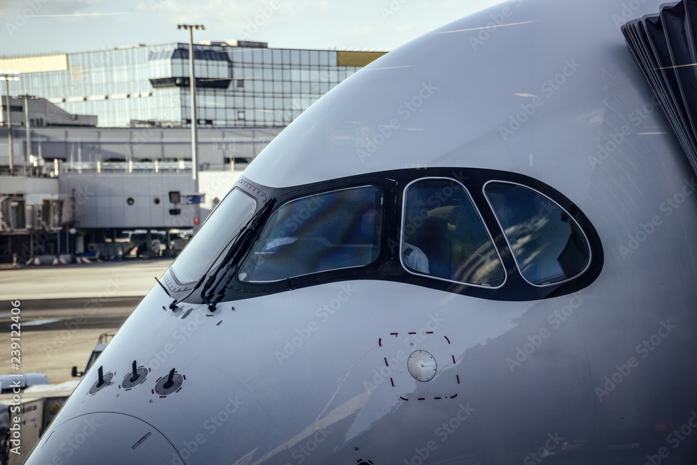 Outside view of an airplane cockpit at the airport. Stock Photo | Adobe ...