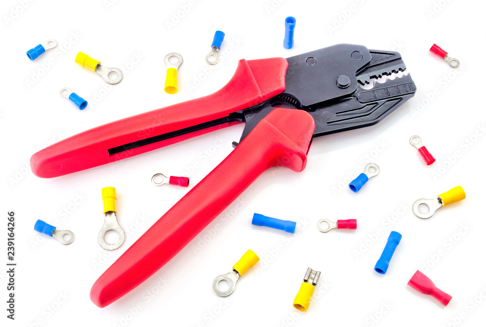 Crimping tool and electrical connectors isolated on white background ...