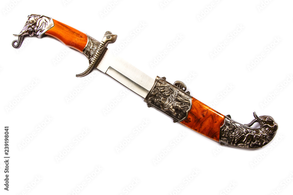 Curved ceremonial dagger knife with a decorative sheath isolated on a ...