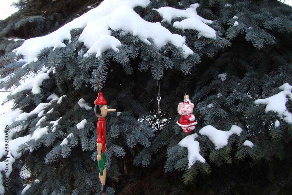 Pinocchio finds the key and on a snow-covered Christmas tree meets the ...