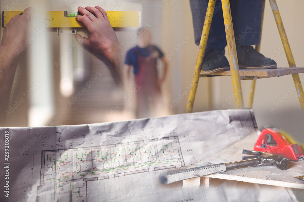 Collage of construction site with architectural plan construction and ...