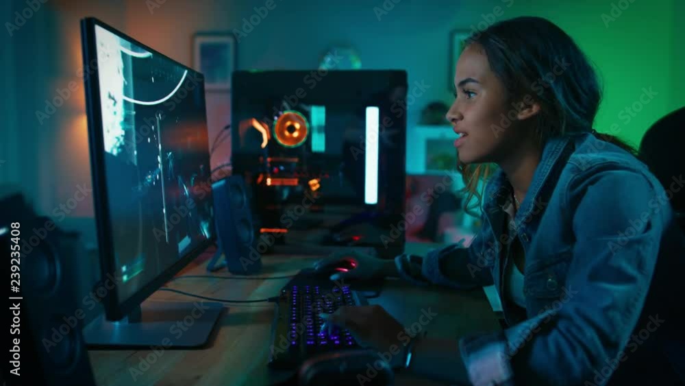 Beautiful and Excited Black Gamer Girl is Playing First-Person Shooter ...