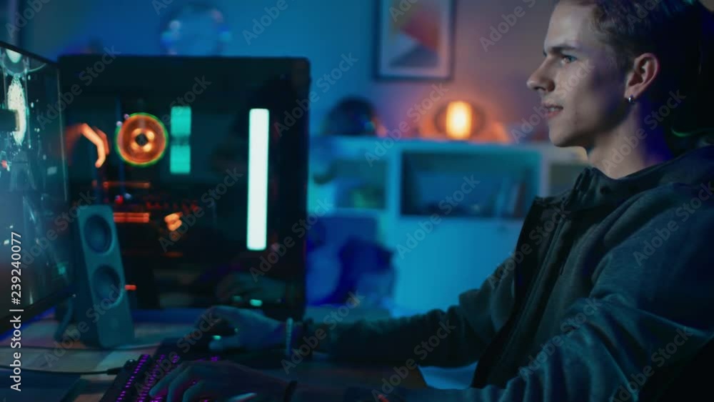 Concentrated Gamer Playing First-Person Shooter Online Video Game on ...