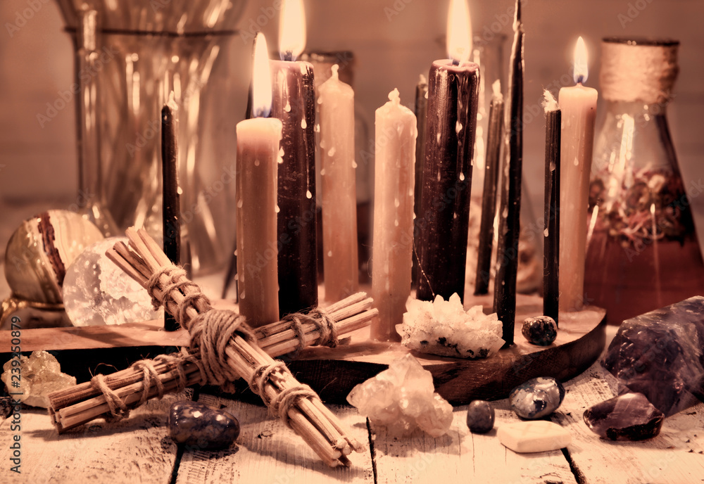Vintage still life with cross, black candles, minerals and flasks on ...