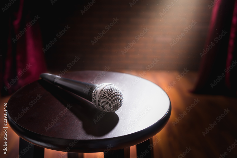 microphone on a wood stool on a stage Stock Photo | Adobe Stock