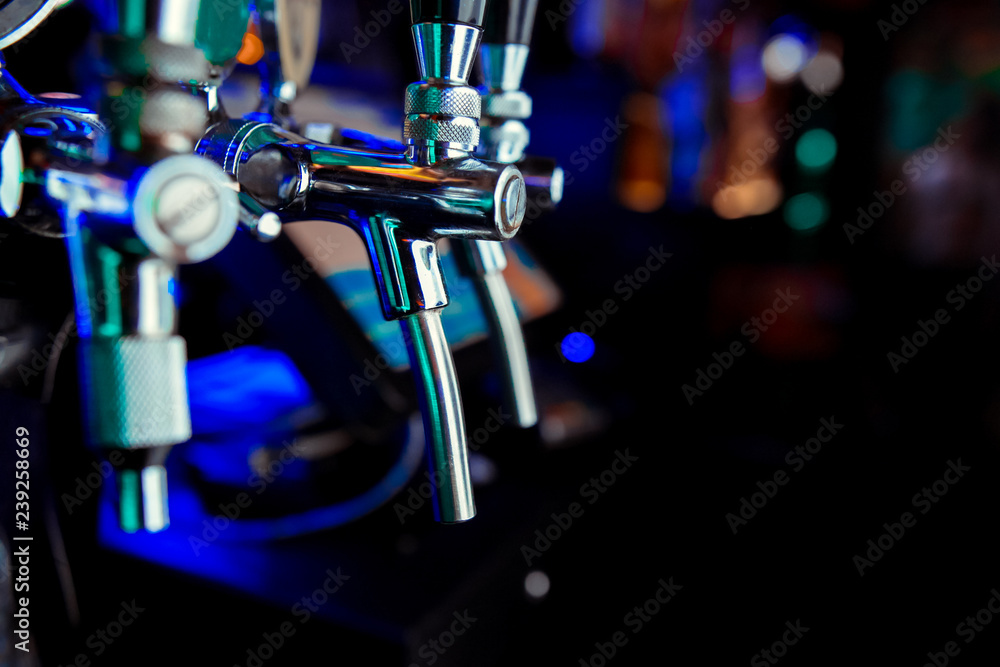 The beer taps in a pub. nobody. Selective focus. Alcohol concept ...
