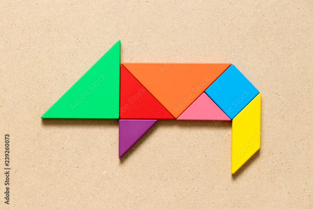 Color tangram puzzle in pig or hog shape on wood background Stock Photo ...