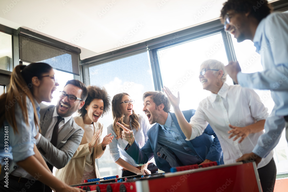 Multiracial people having fun in office room, excited diverse employees ...
