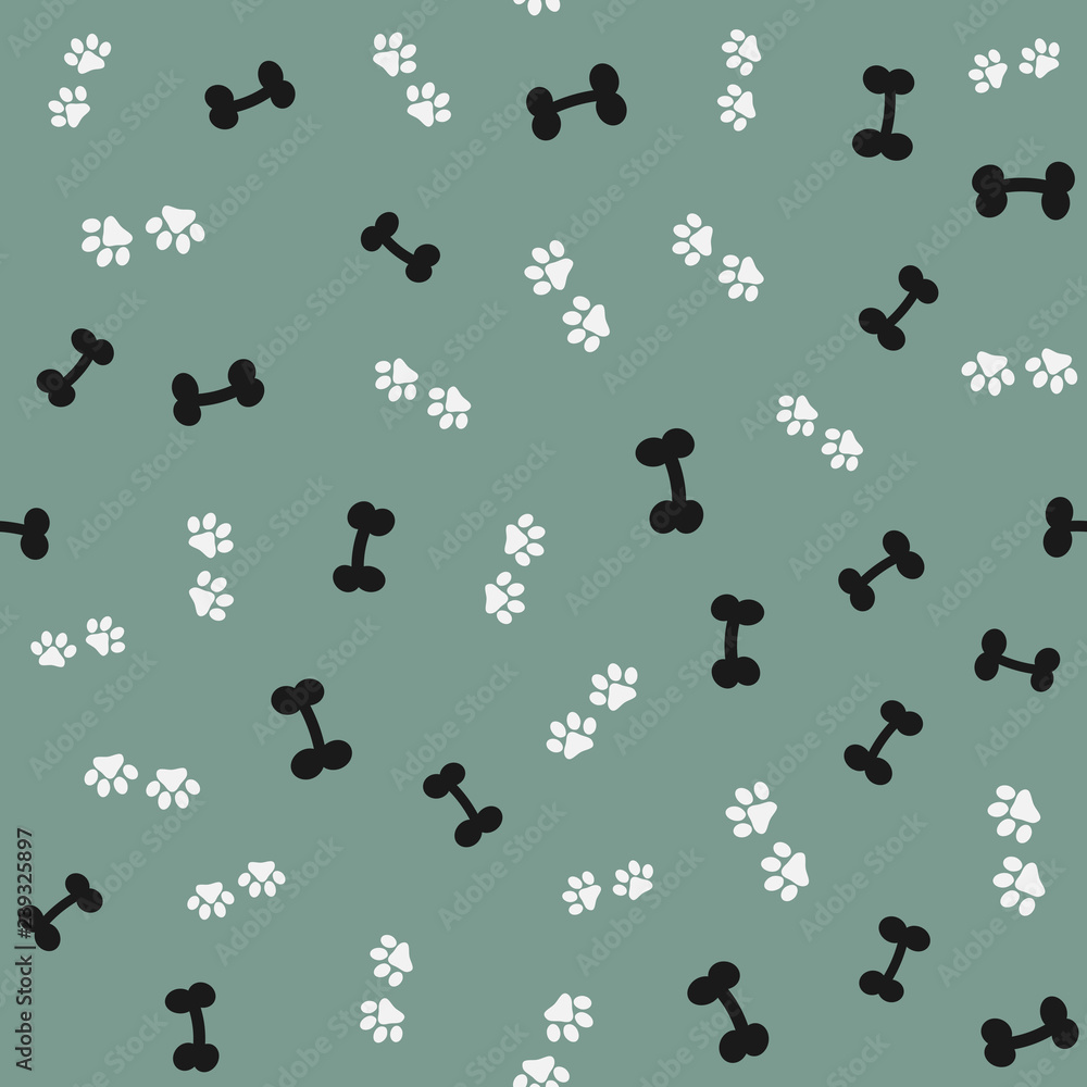 Repeated silhouettes of bones and animal paw prints. Seamless pattern ...