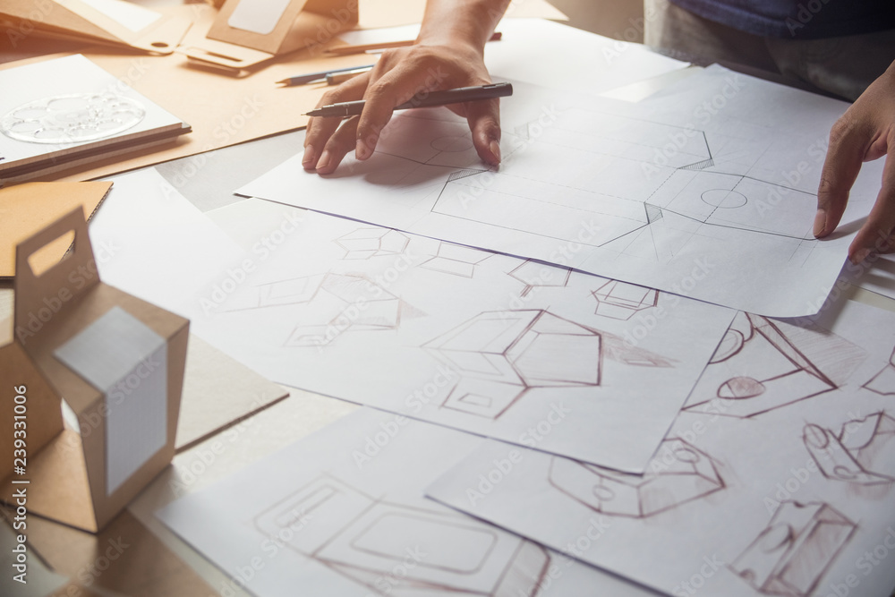 Designer sketching drawing design Brown craft cardboard paper product ...