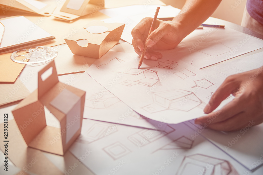 Designer sketching drawing design Brown craft cardboard paper product ...