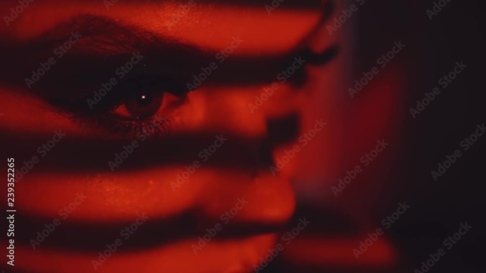 Abstraction of their red lines on the girl's face. Close up of the girl ...