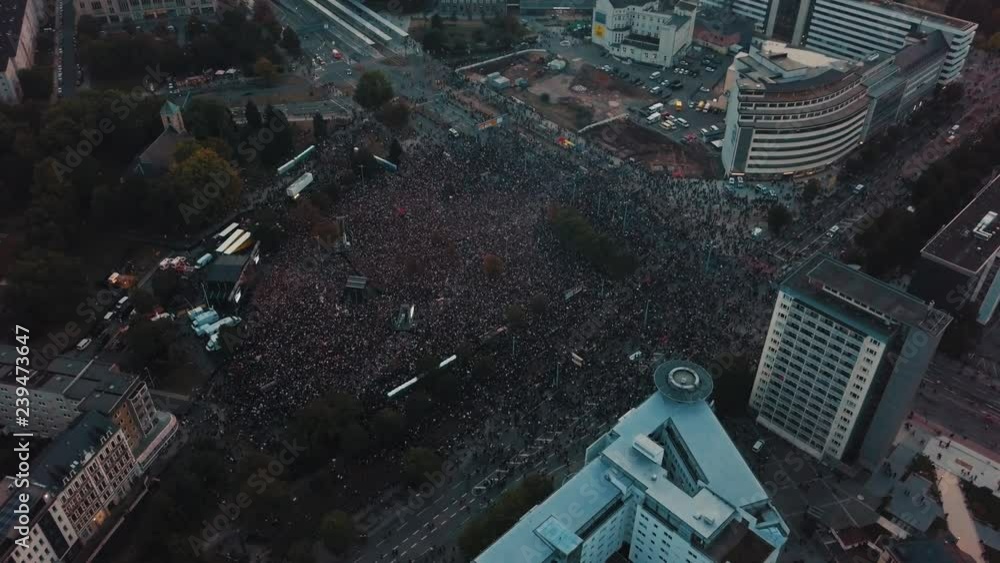 Aerial drone panning above Cheminitz, Germany city as thousands people ...