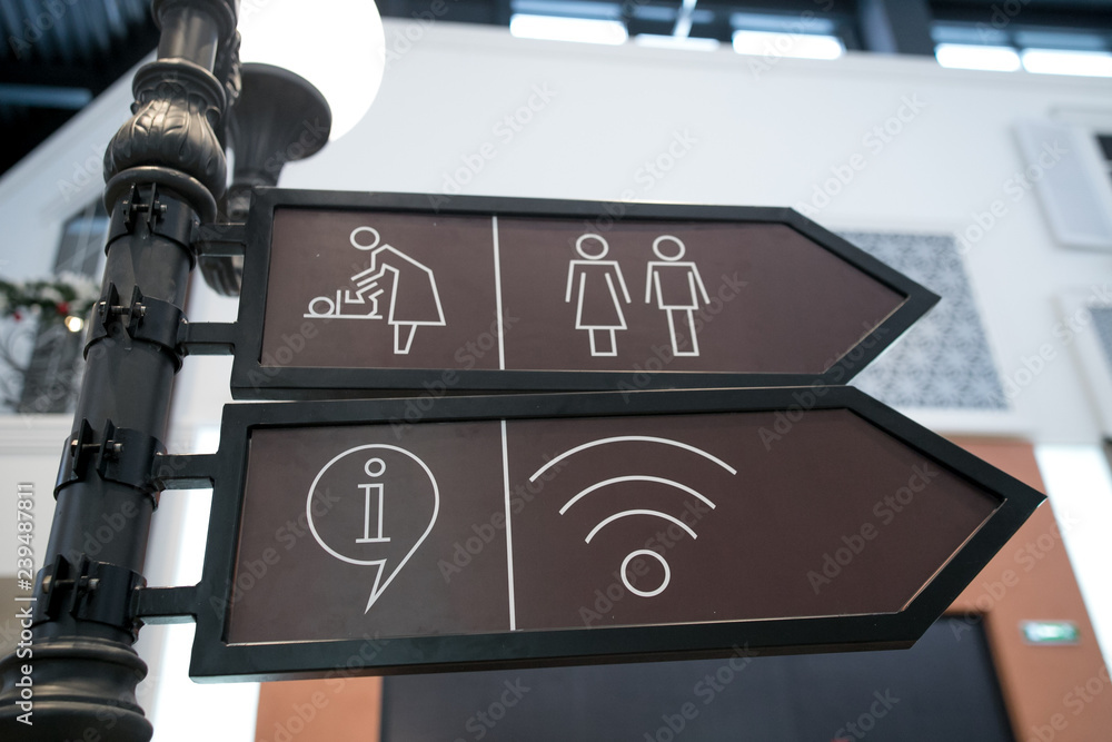 Lighting shop and restroom direction signs in the mall Stock Photo ...