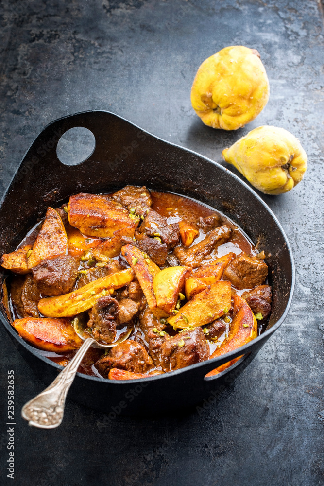 Traditional Iranian khoresh beh stew with chunks of lamb and quinces as ...