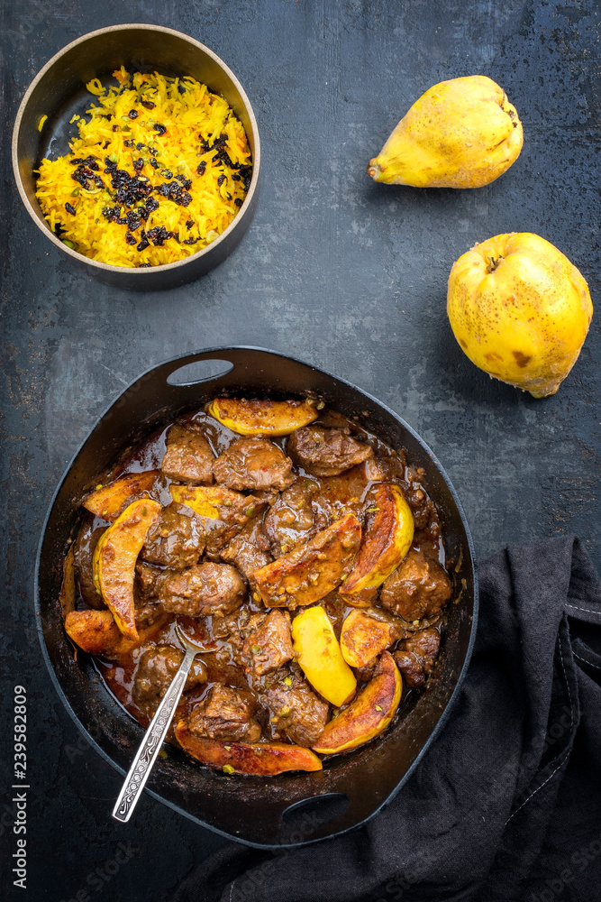 Traditional Iranian khoresh beh stew with chunks of lamb, quinces and ...