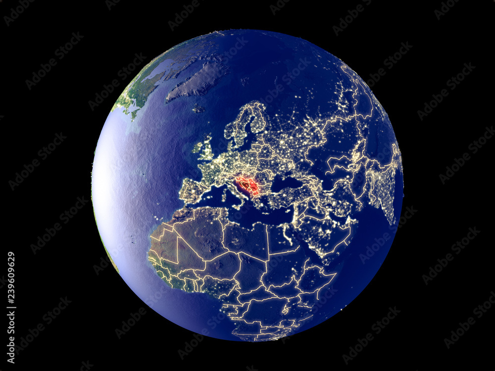 Former Yugoslavia from space on model of planet Earth with city lights ...