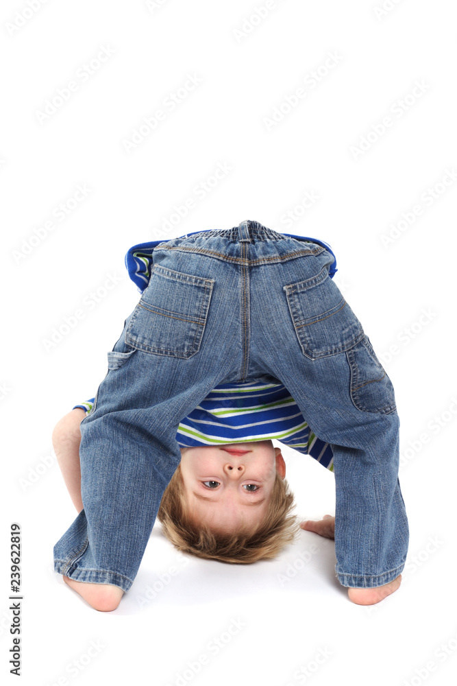 Young boy bending over and looking through his legs Stock Photo | Adobe ...