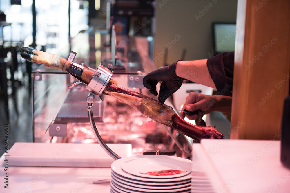 Preparation of a jamon meat from the leg is seen on the picture. The ...
