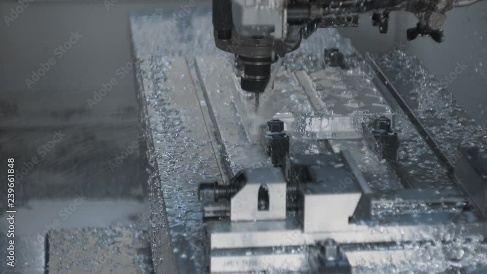 Cnc metal working machine with cutter tool luminium detail milling at factory. Tech process of ...