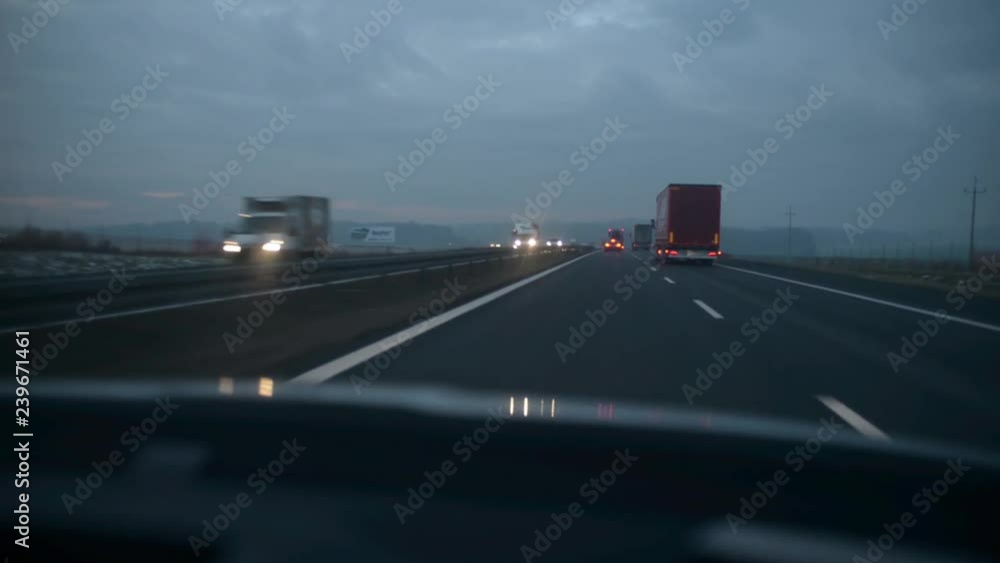 Driving a Car on a Highway at the Night - view from the Front Window ...
