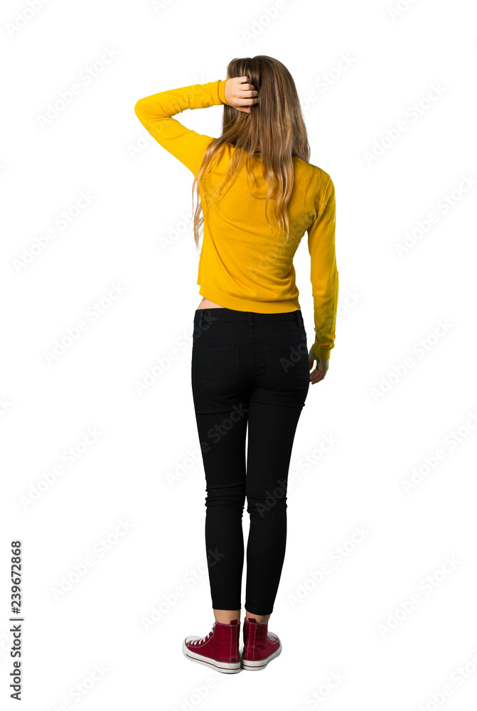 A full-length shot of a young girl with yellow sweater on back position ...