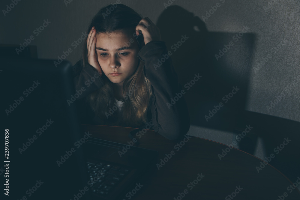 Teenager girl suffering internet cyber bullying scared and depressed ...