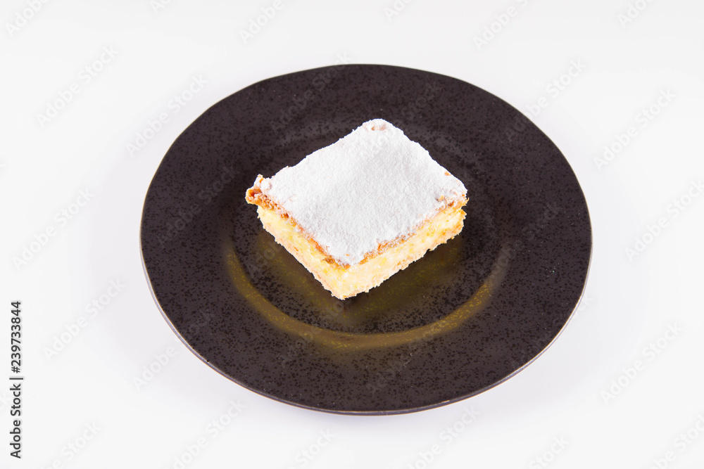 Napoleonka cake - a Polish type of cream pie - sprinkled with powdered ...