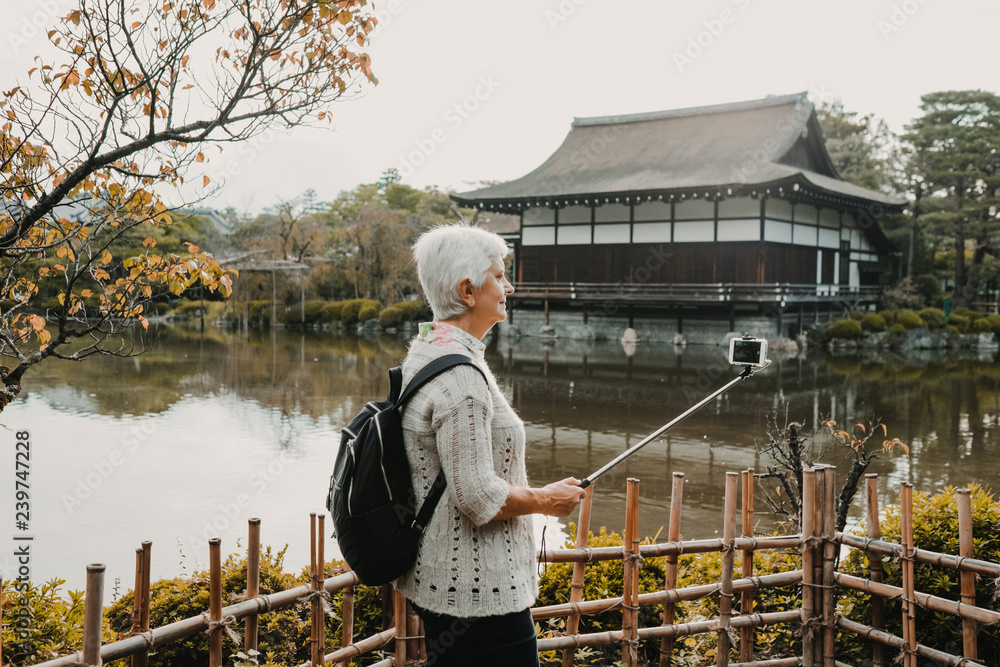 .Middle-aged occidental woman discovering the nipon country. Tourism in ...
