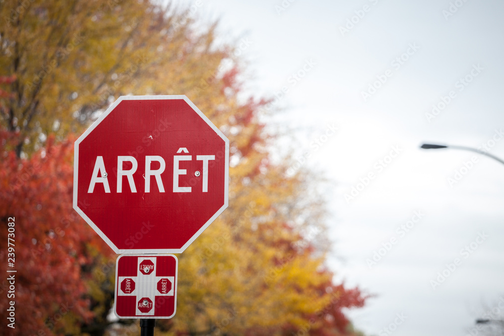 Quebec Stop Sign, obeying by bilingual rules of the province imposing ...
