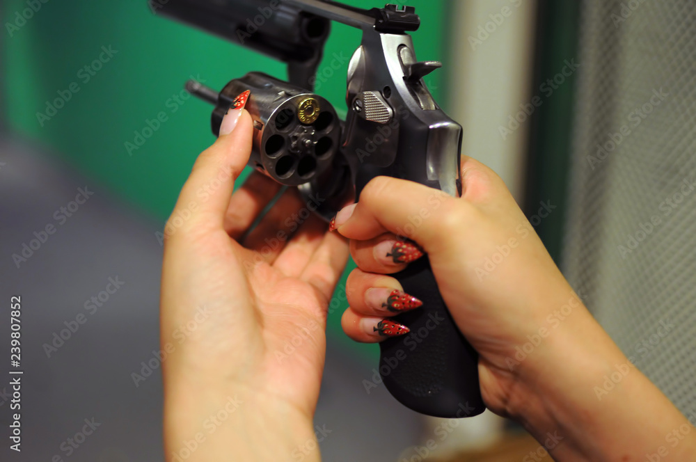 A 45 caliber revolver reloading in the woman's hands Stock Photo ...