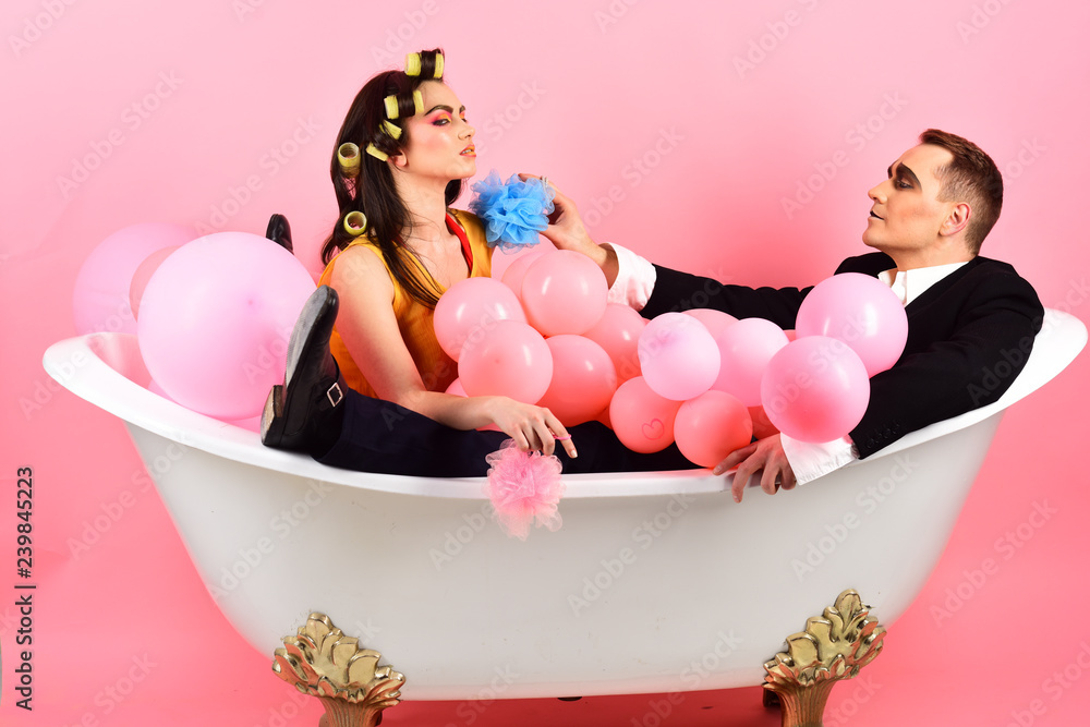 Bubble bath day. Couple in bath tub. Couple of mime man and sexy woman ...