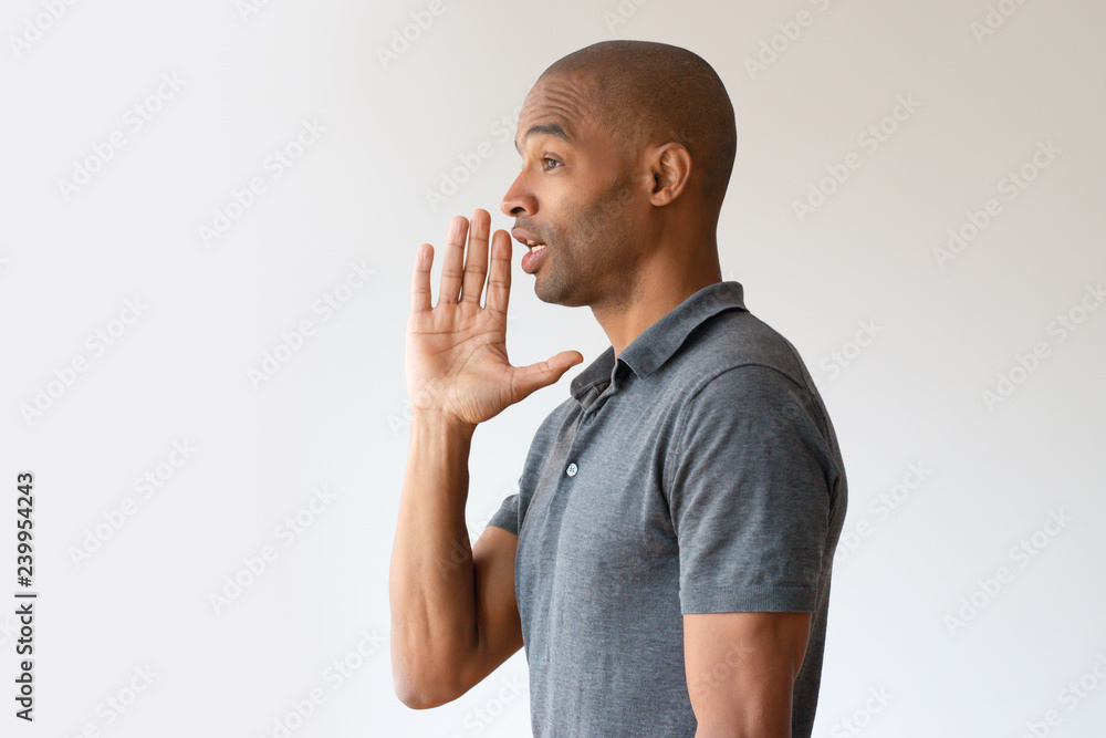 Amazed black guy announcing important news. Side view of young man ...