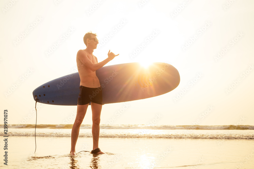 shaka hand gesture surfers symbol.young surfer man with surfboard on ...
