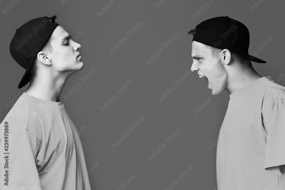 Twin brothers having quarrel with each other Stock Photo | Adobe Stock