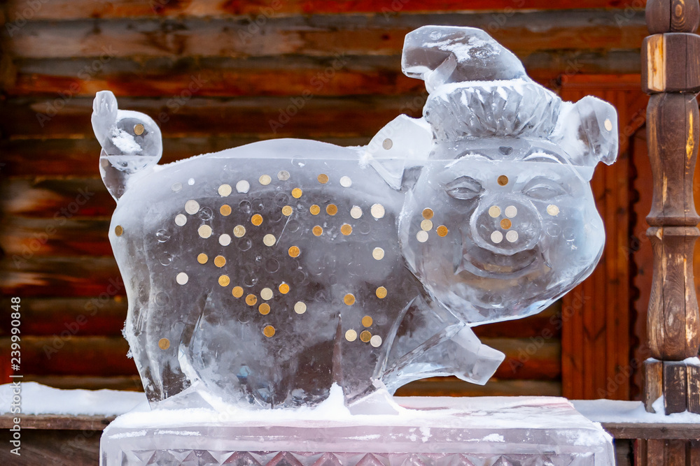 Ice sculpture-a Pig - a symbol of 2019. Ice pig happiness with coins ...