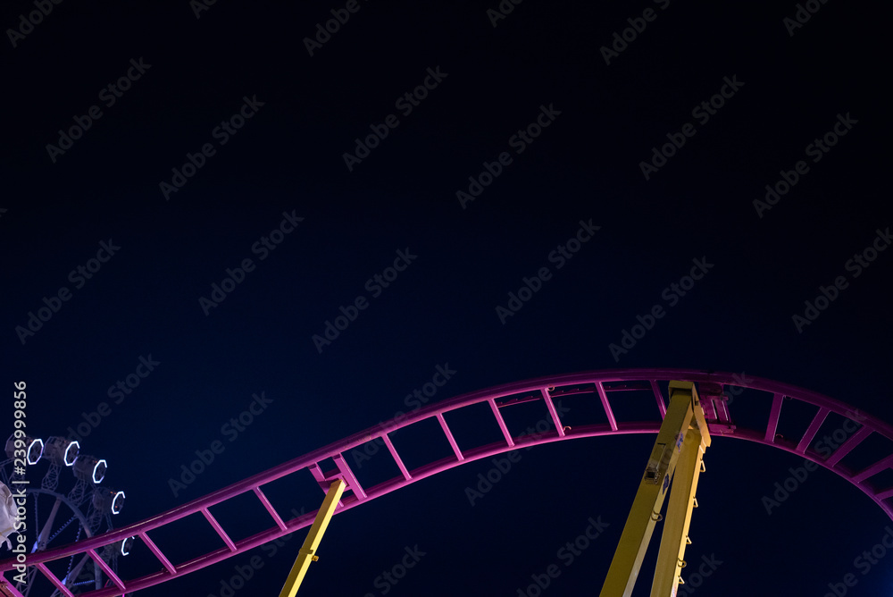 Rails of a roller coaster, blue night sky background. Stock Photo ...