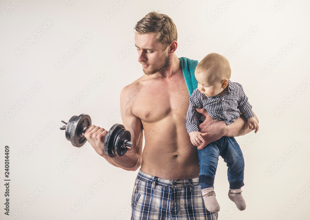 Keeping fit. Father and child training together. Healthy family ...